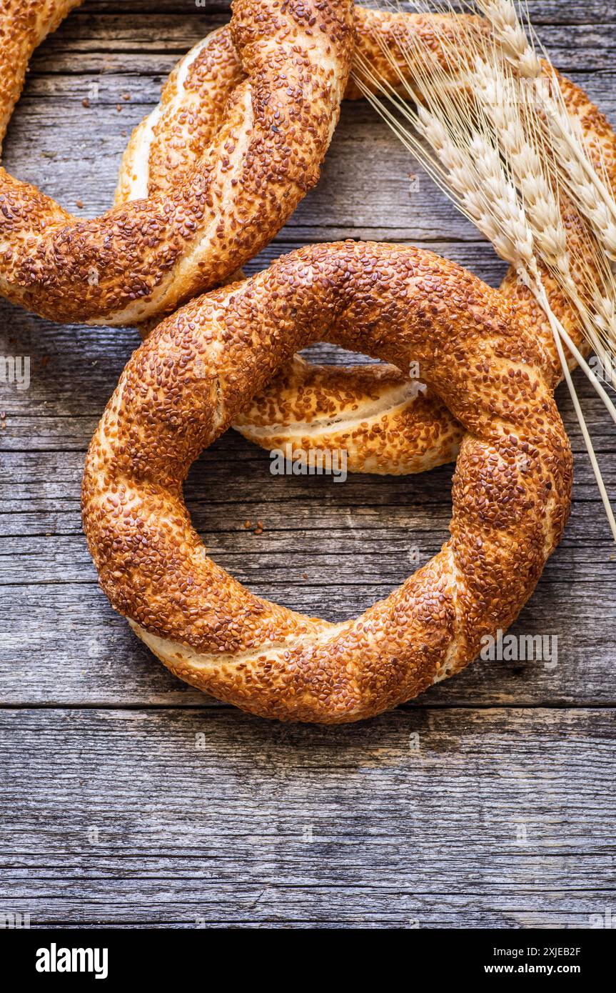 Turkish traditional bagel / simit with sesame on rustic table, turkish ...