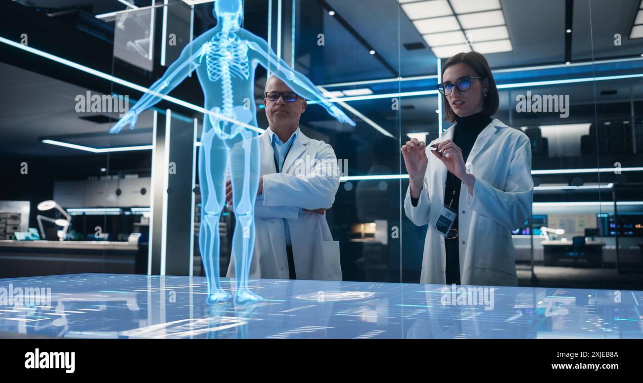 Two Bioengineers Working With Computer-Powered VFX Hologram Of Human ...