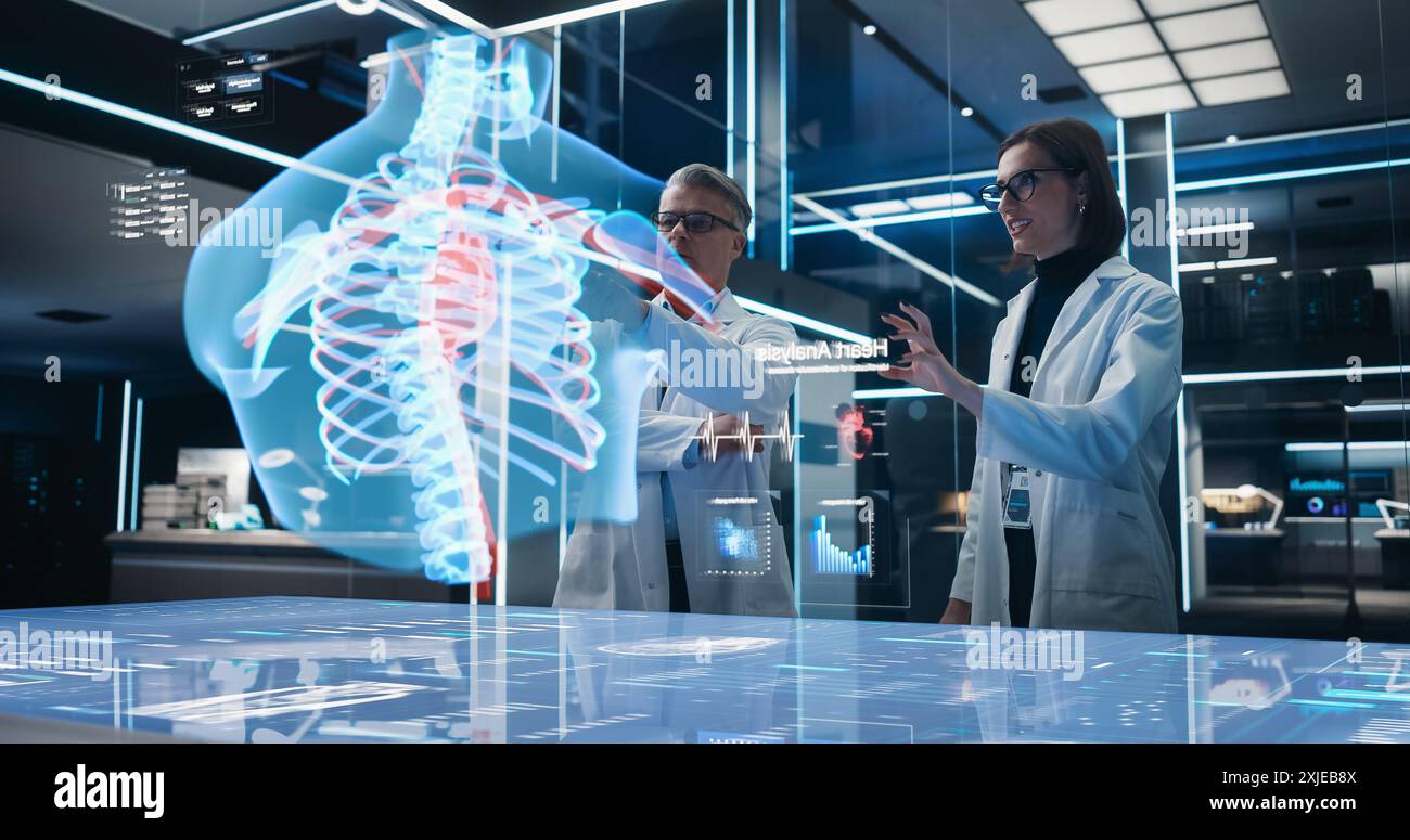 Two Bioengineers Working With Computer-Powered VFX Hologram Of Human ...