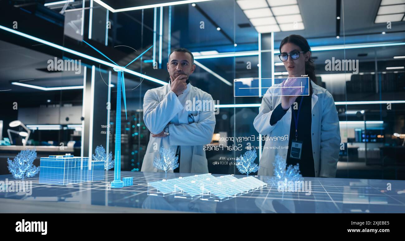 Male And Female Industrial Engineers Using Futuristic Hologram of Wind ...