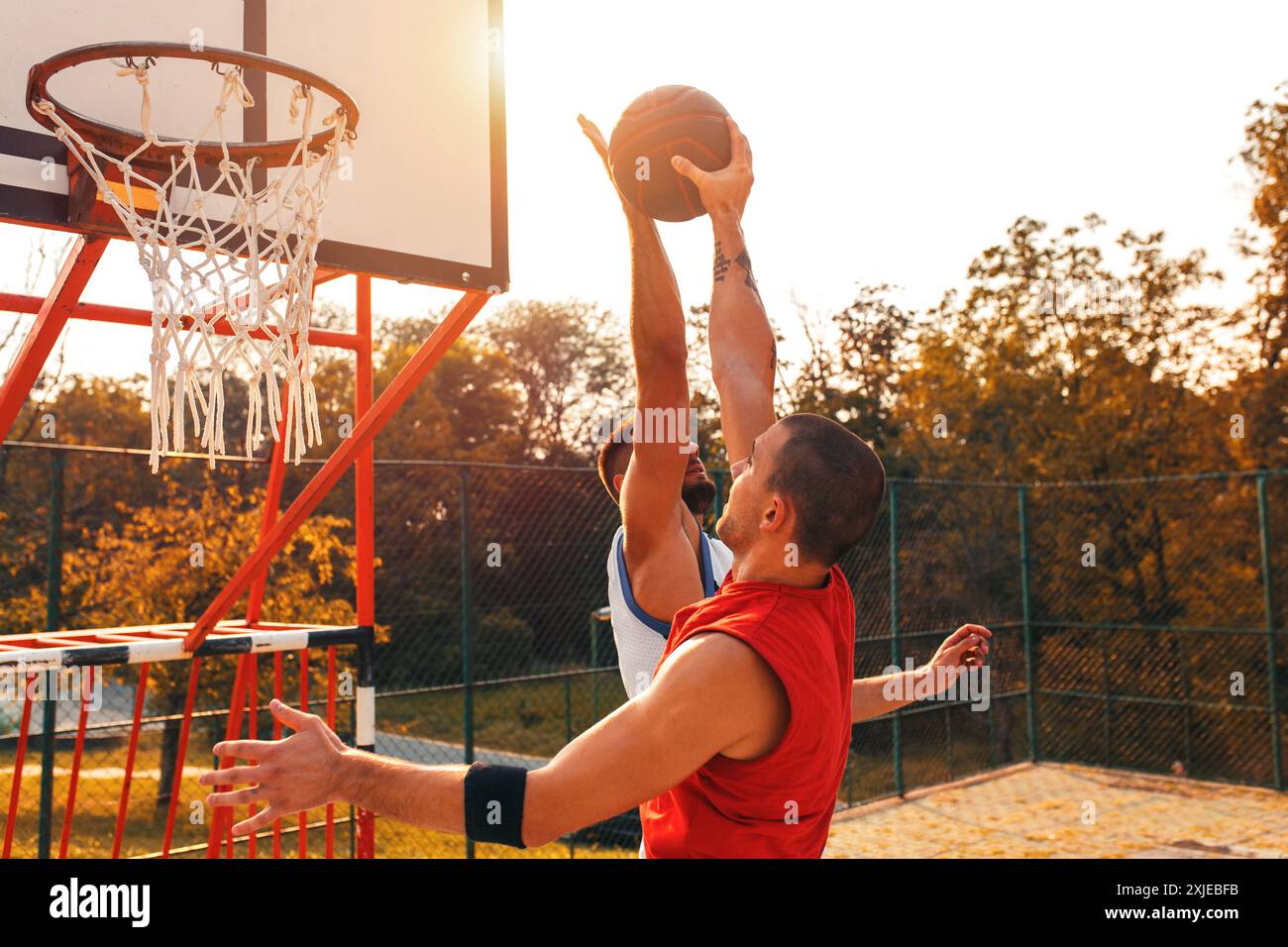 People playing basketball outdoors hi-res stock photography and images ...