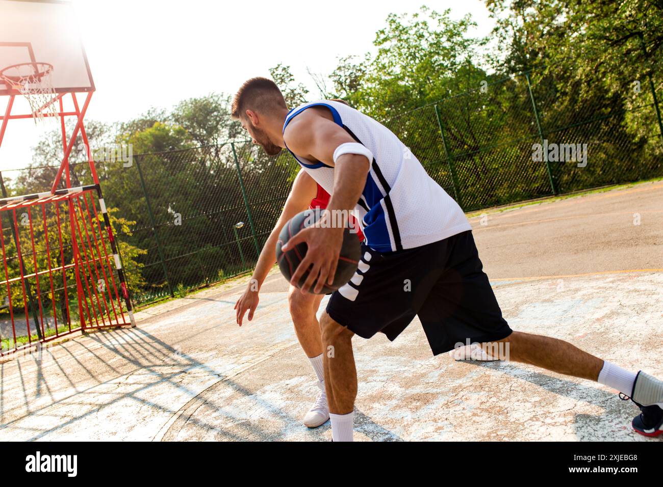 People playing basketball outdoors hi-res stock photography and images ...