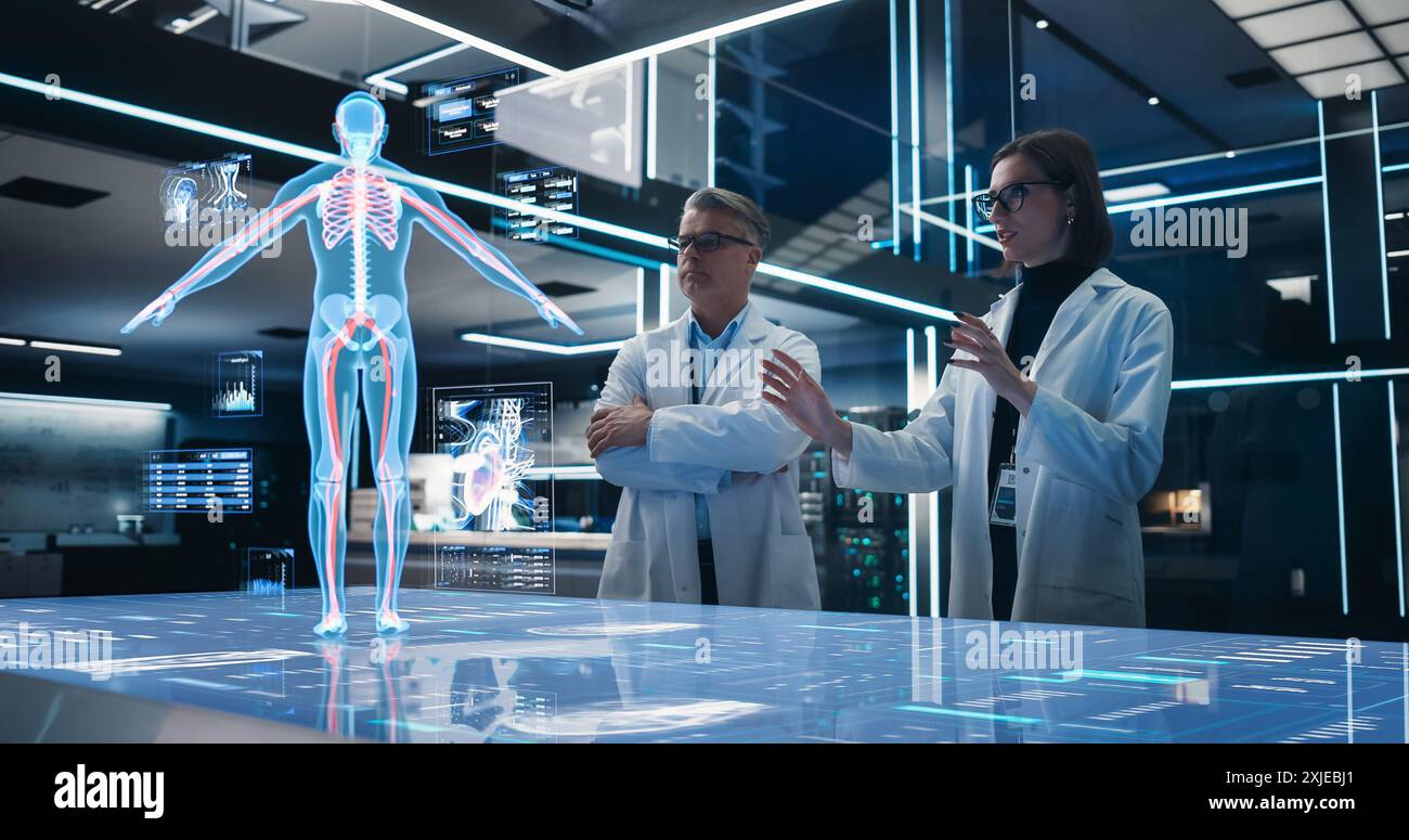 Two Bioengineers Working With Computer-Powered VFX Hologram Of Human ...