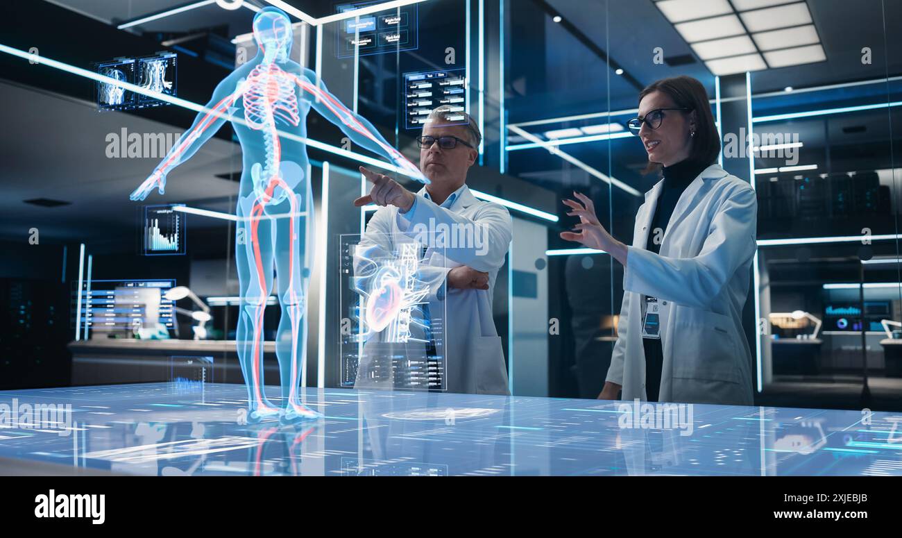 Two Bioengineers Working With Computer-Powered VFX Hologram Of Human ...