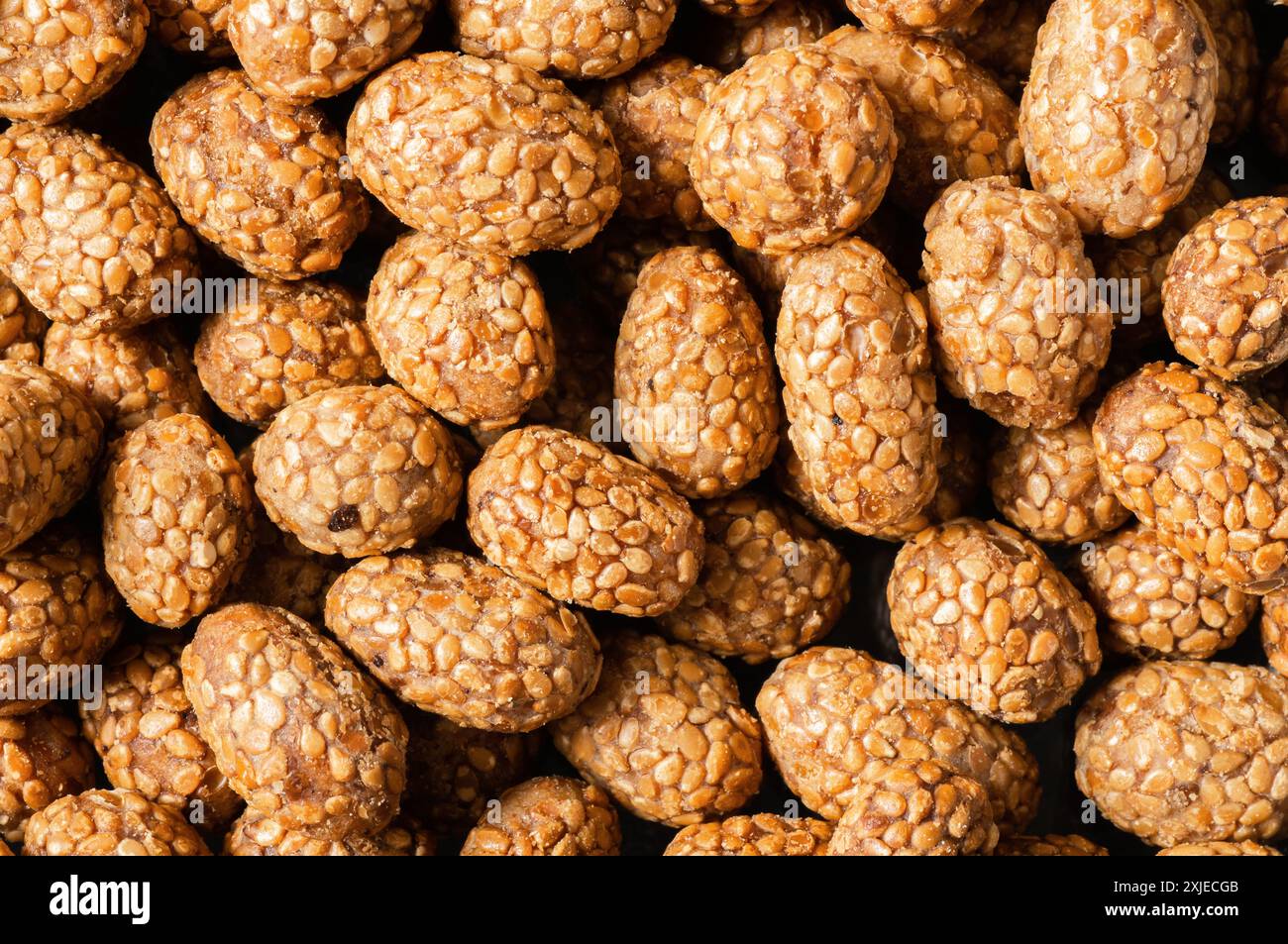 Sesame coated peanuts with honey and molasses, traditional turkish nut ...
