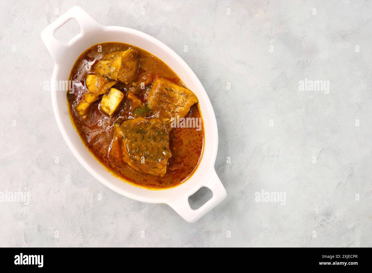 Indian Food. Homemade Spicy and tangy dadha or threadfin fish curry ...