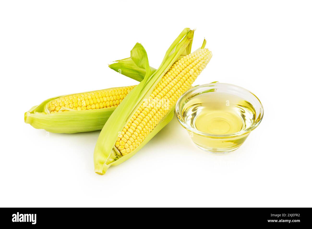Corn oil in glass with fresh ripe corn cobs isolated on white ...