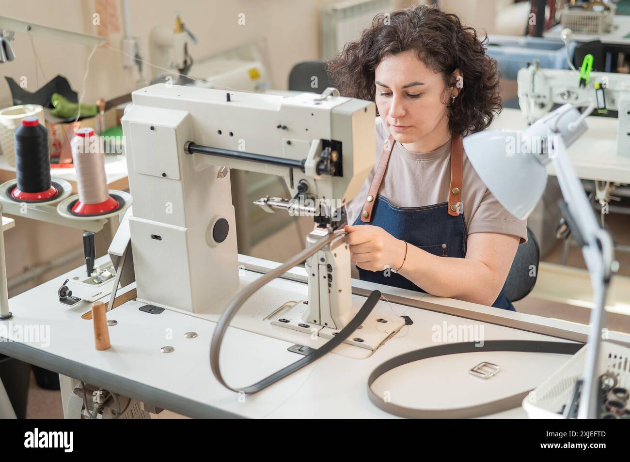 Woman tanner sews leather hi-res stock photography and images - Alamy
