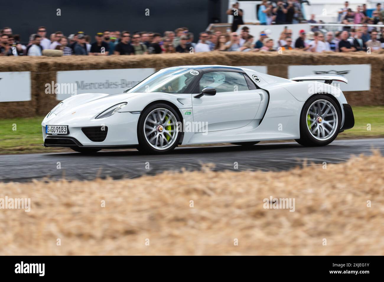 2014 Porsche 918 Spyder hybrid sports car driving up the hill climb ...