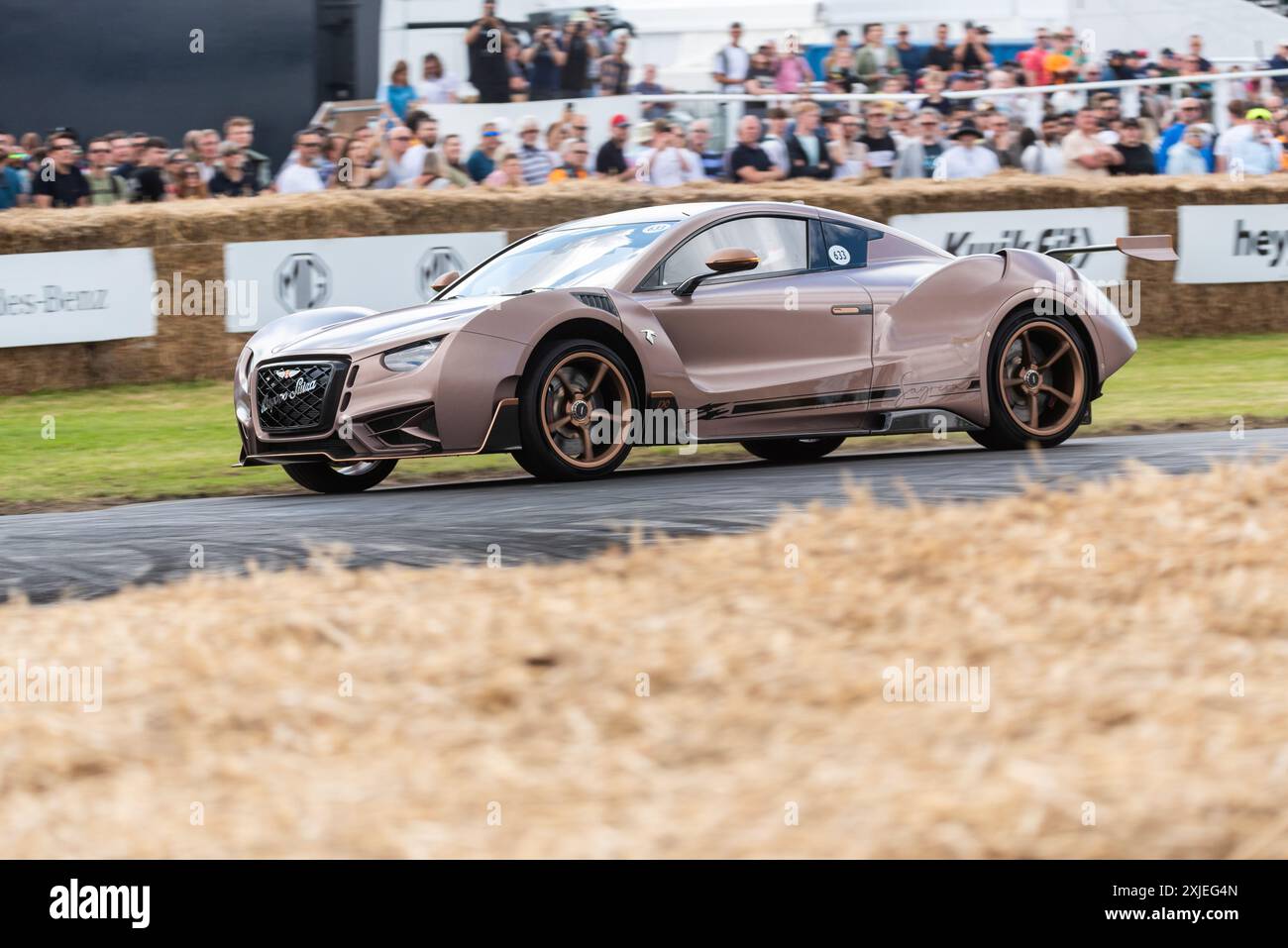 2024 Hispano Suiza Carmen Sagrera electric sports car driving up the hill climb track at the ...