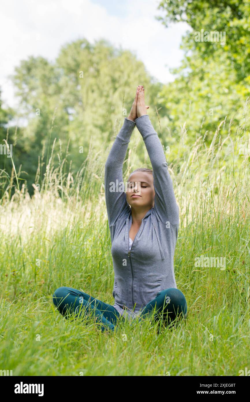 Young woman deep stretch in hi-res stock photography and images - Alamy