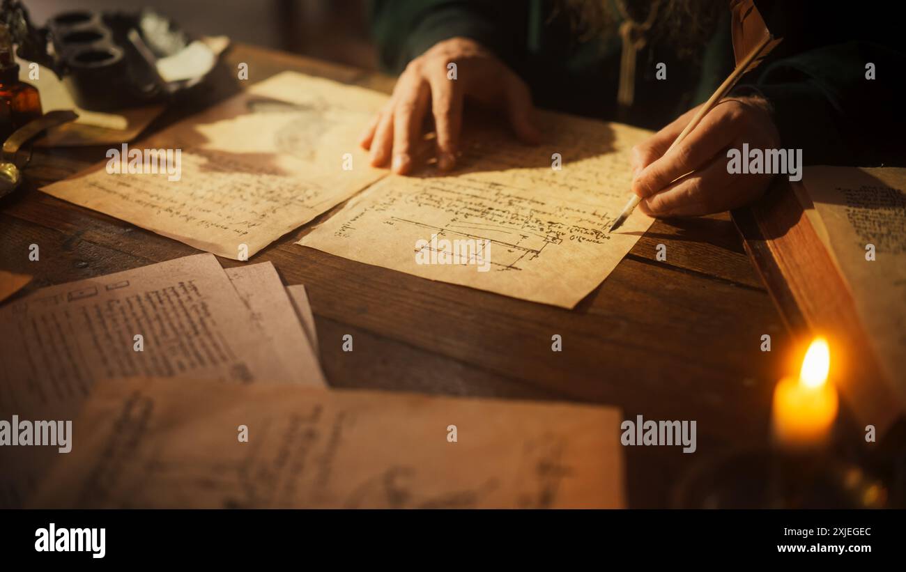 Close Up on Old Renaissance Male Hand Using Ink and Quill to Draw a ...