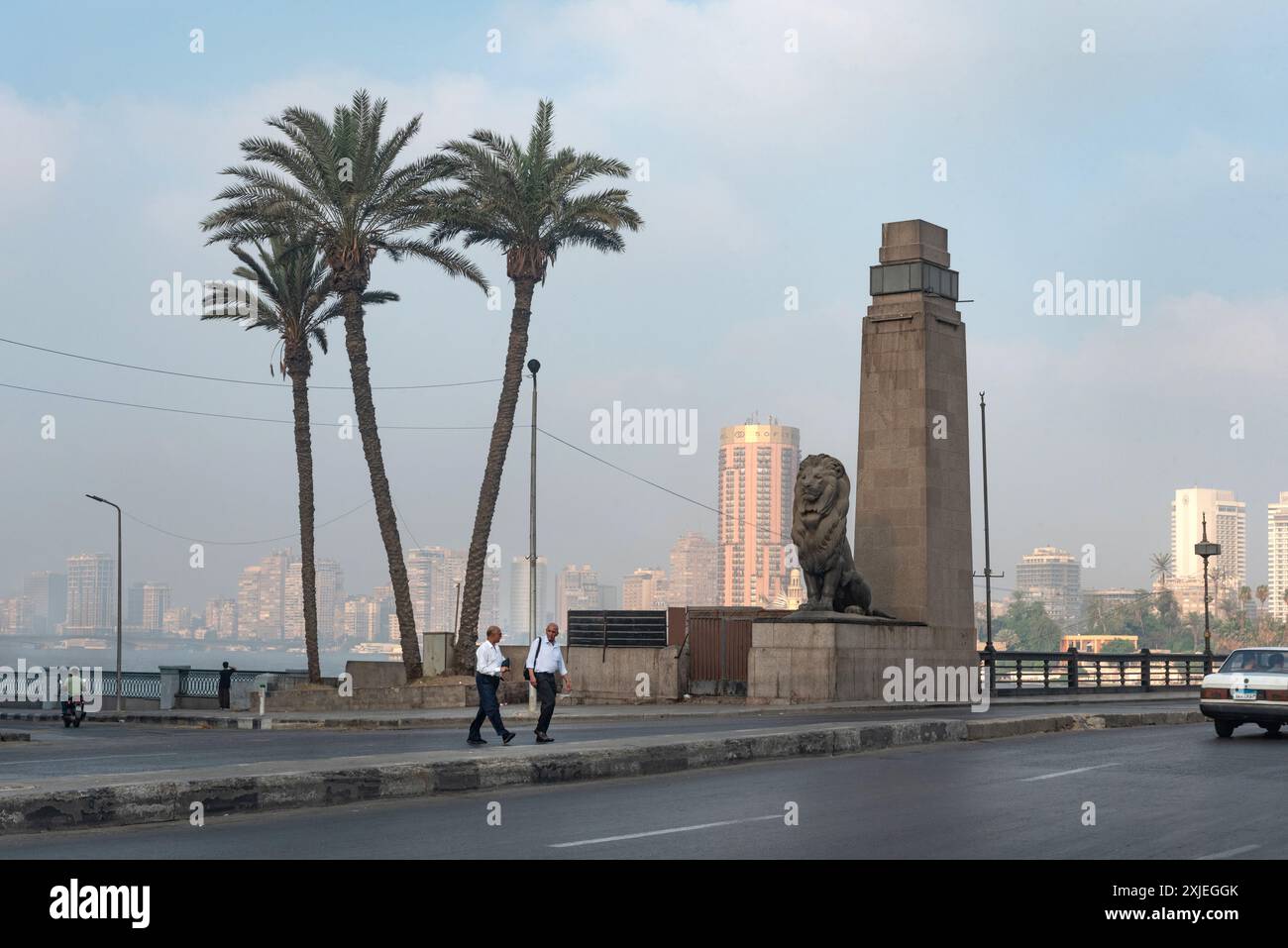Cairo, Egypt. July 1st 2024 Two Egyptian men cross the Qasr El Nil ...