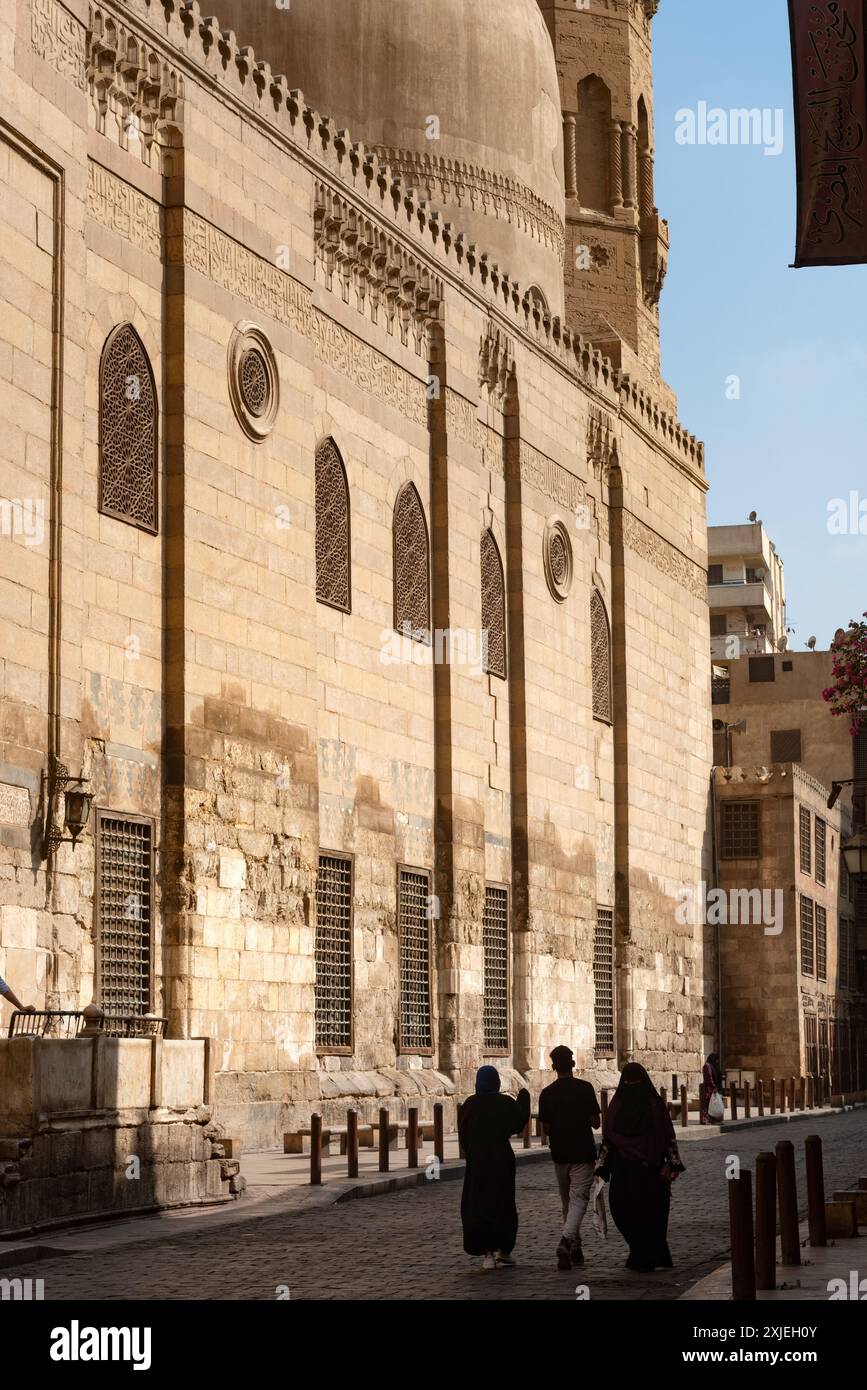 Local tourists walk past one of the many restored monuments along ...