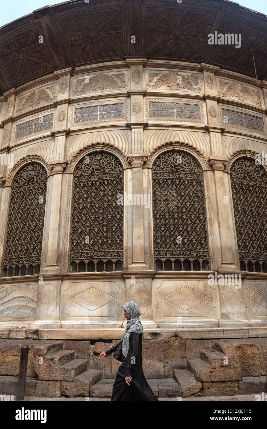 Cairo, Egypt. July 7th 2024 A local woman walks past one of the many ...