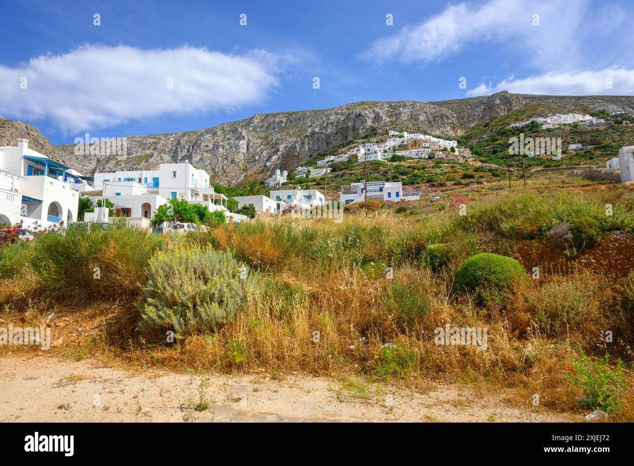 Greek white houses on the hillside in Aegiali village. Amorgos island ...