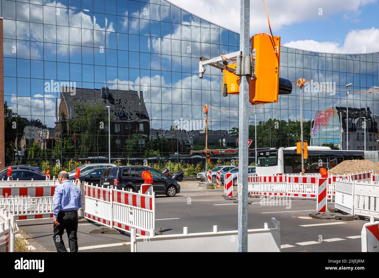 construction site barriers on Bonner street, glass facade of an office ...
