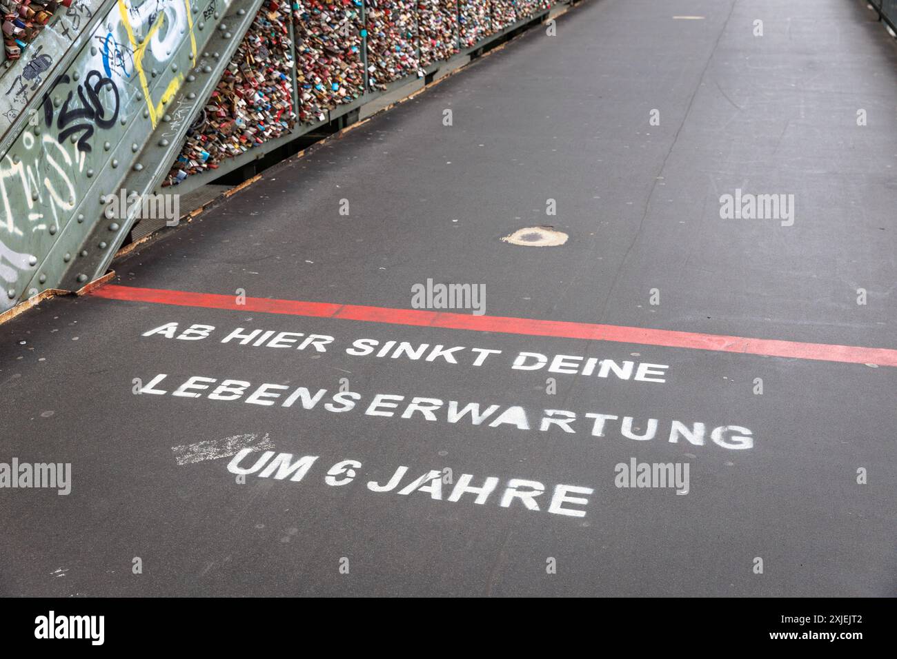 slogan on the Hohenzollern Bridge "From here your life expectancy drops ...