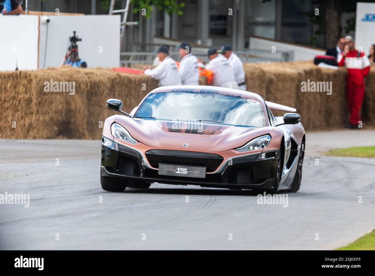 2024 Rimac Nevara electric sports car driving up the hill climb track at the Goodwood Festival ...