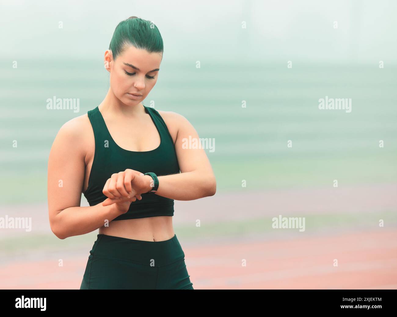 Woman, outdoor fitness and check smart watch for heart rate, exercise ...