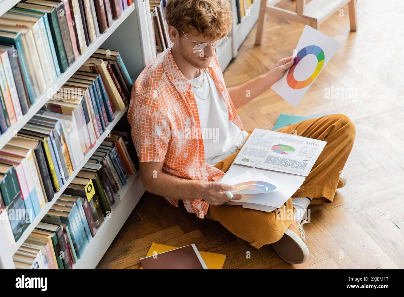 Absorbed man reading book sitting hi-res stock photography and images ...