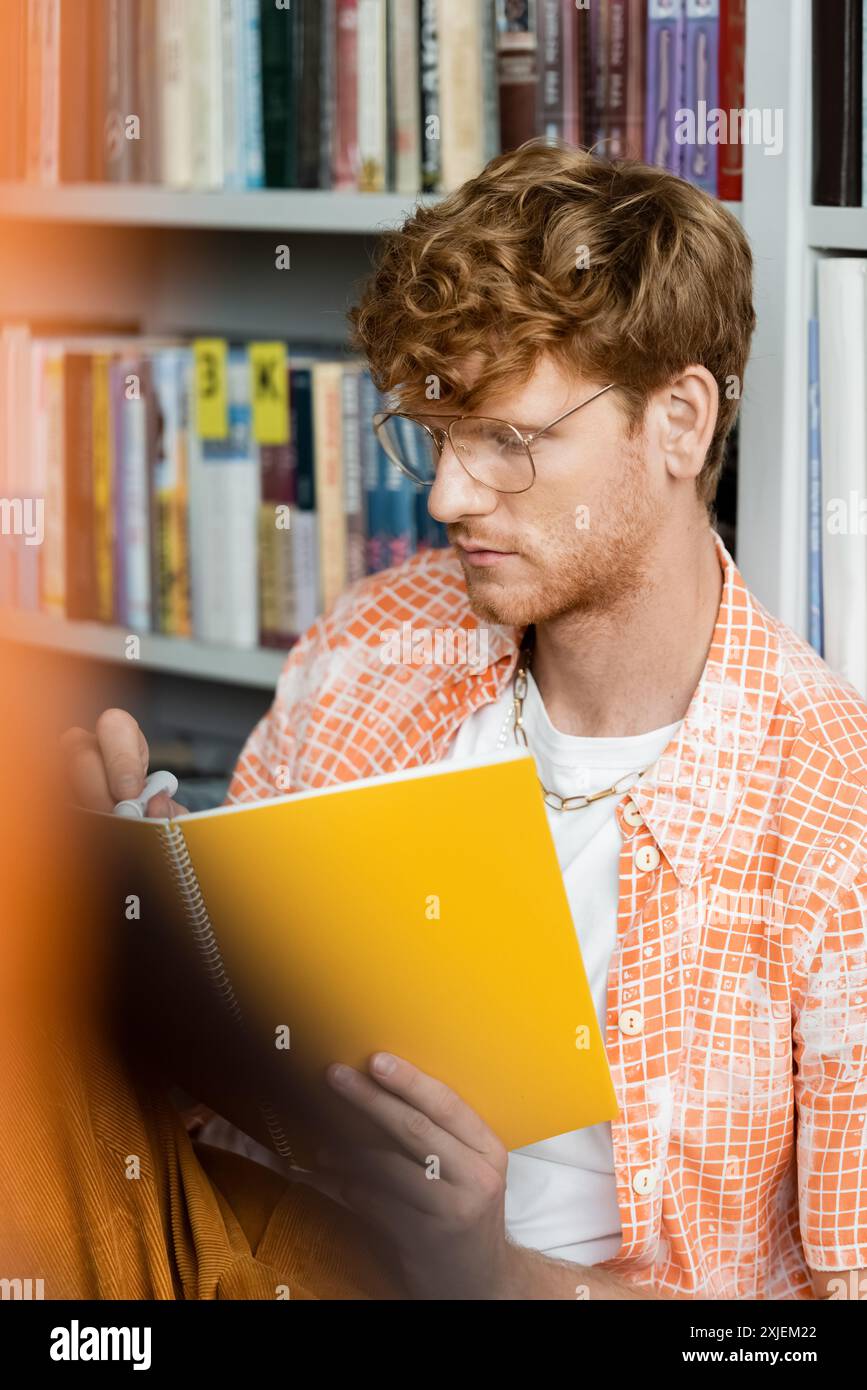 Studying alone in library hi-res stock photography and images - Alamy