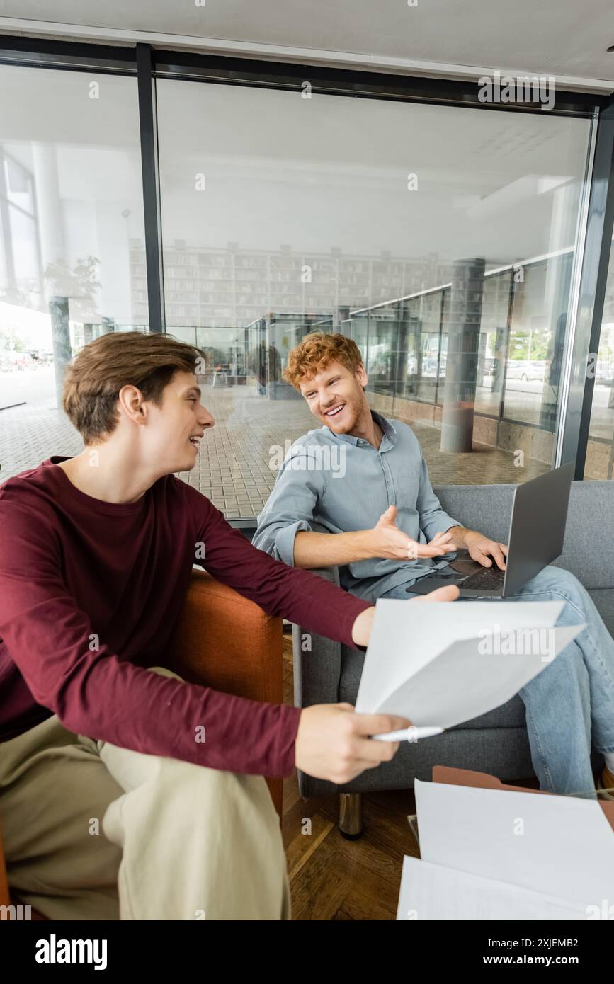 Two young men studying together in a library Stock Photo - Alamy