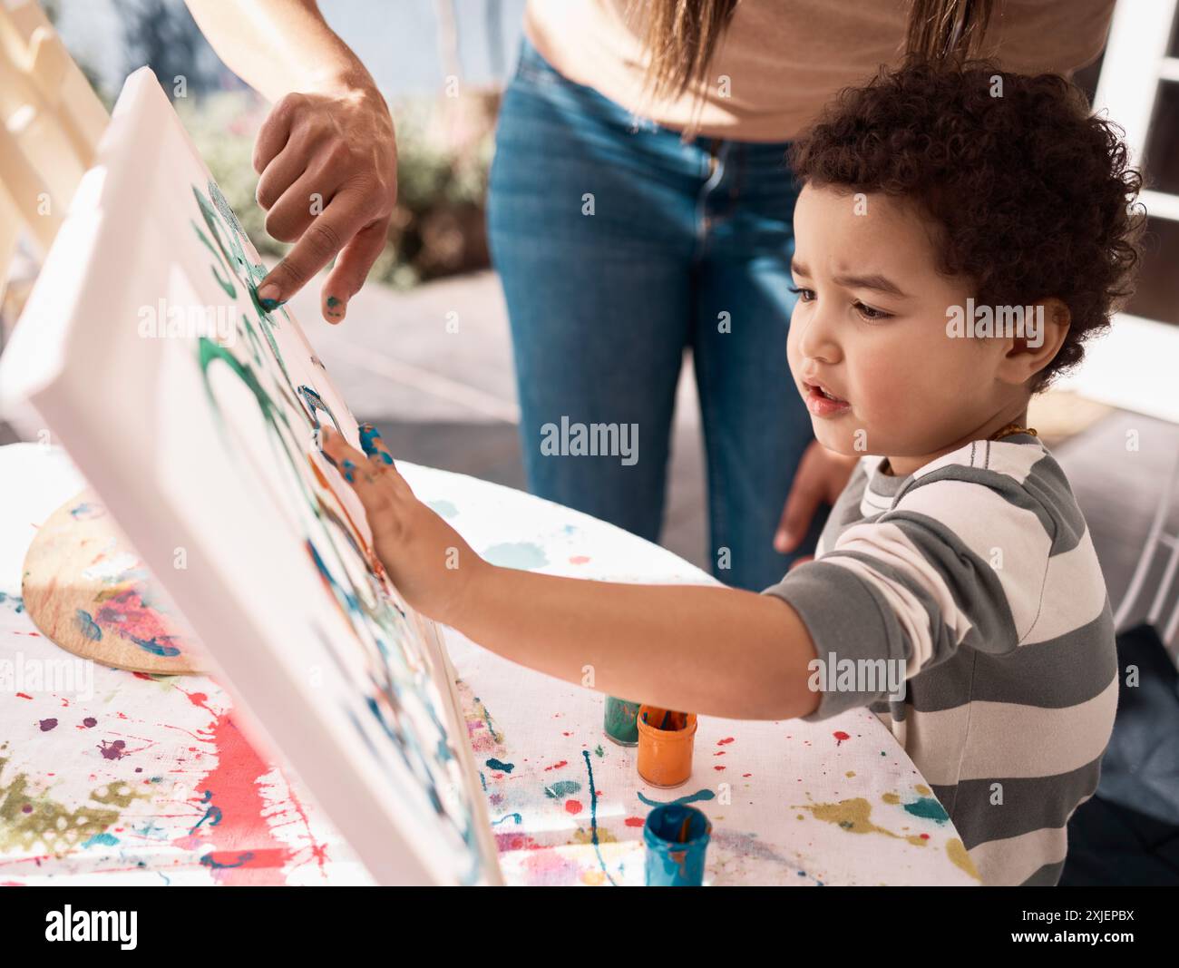 Painting, canvas and child in home, creative and growth of development ...