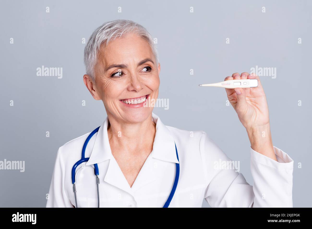 Photo of aged lady professional doctor thermometer look empty space ...