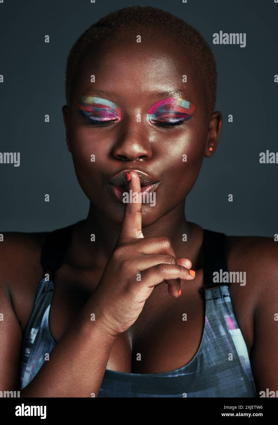 Black woman whisper finger hi-res stock photography and images - Alamy