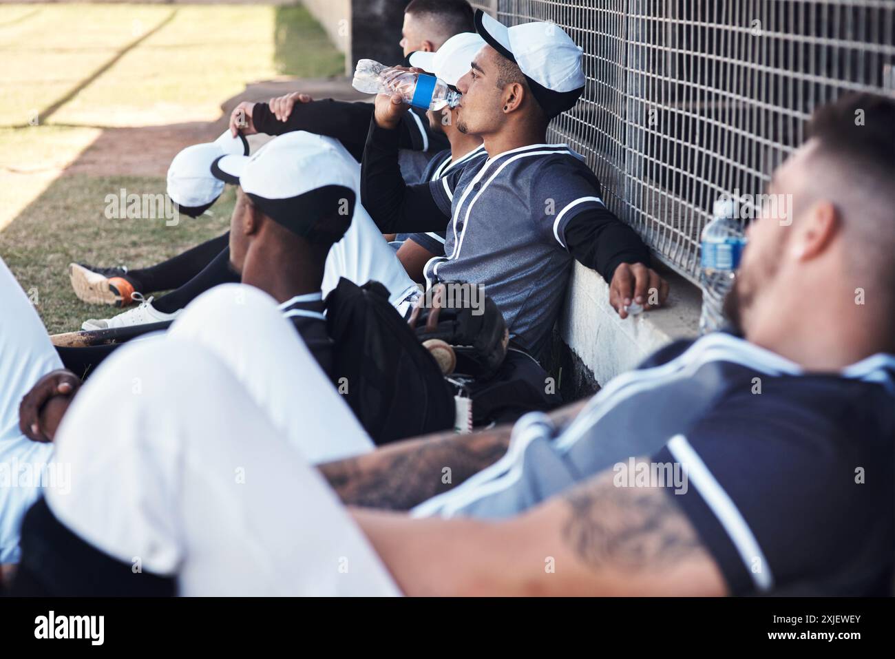 Baseball, exercise and field with team for water and rest, break and ...