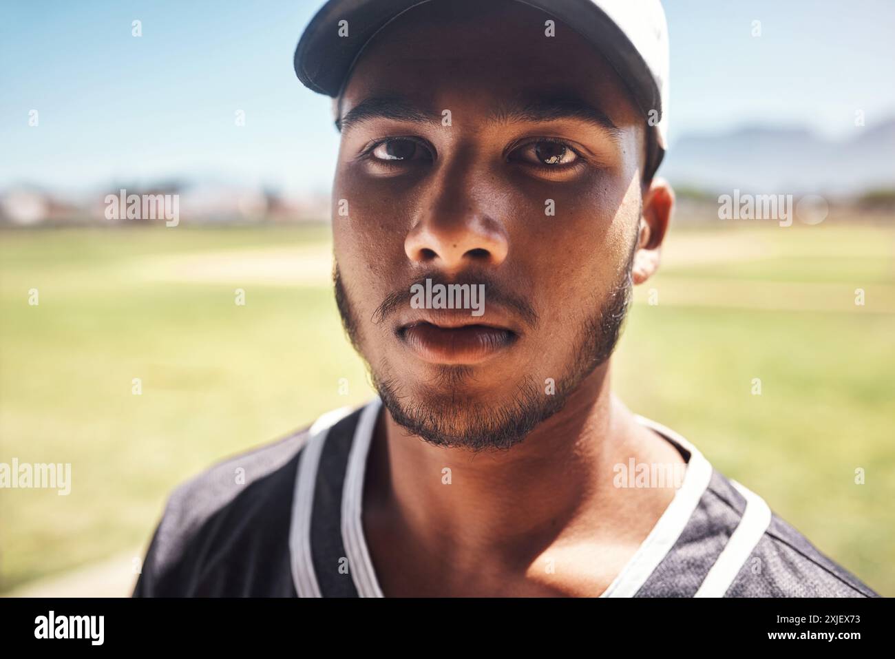 Baseball player, cap and portrait of man on field for summer sport ...