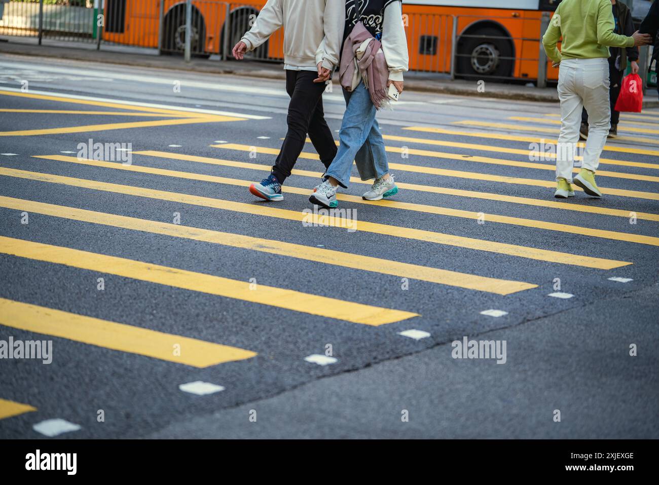 Hong Kong, China - January 03, 2024 : Three people walking across a ...
