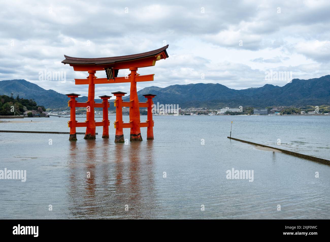 Japan, Itsukushima Shrine, Shinto floating torii orange red gate in the ...