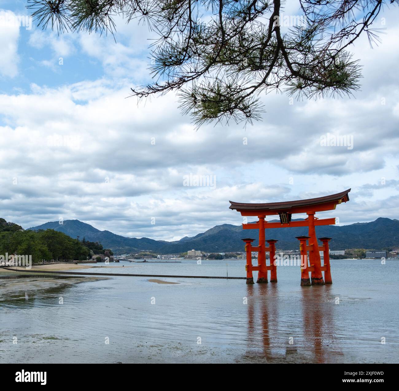 Japan, Itsukushima Shrine, Shinto floating torii orange red gate in the ...