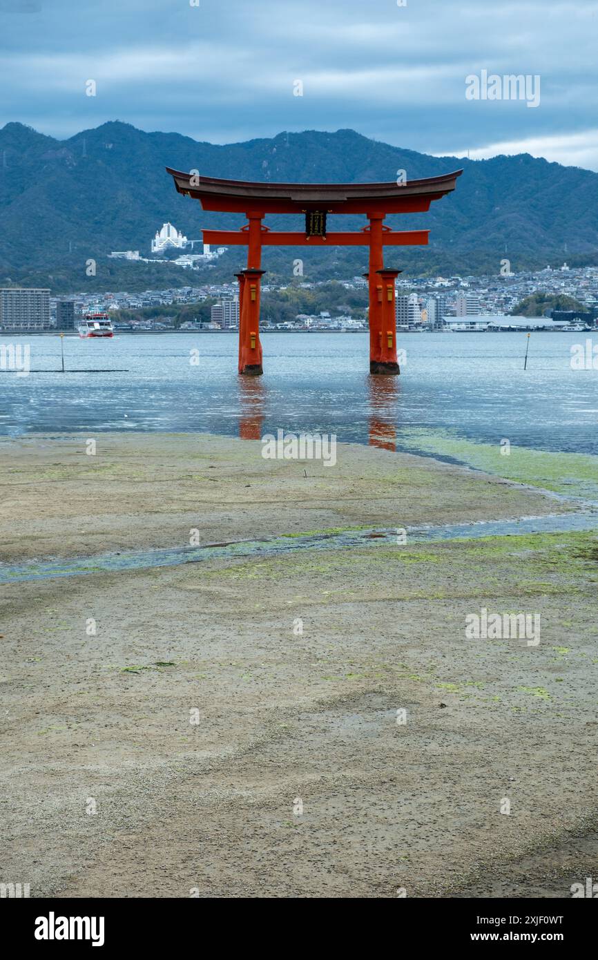 Japan, Itsukushima Shrine, Shinto floating torii orange red gate in the ...