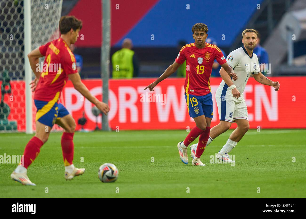 Lamine Yamal, ESP 19 Robin Le Normand, ESP 3 compete for the ball ...
