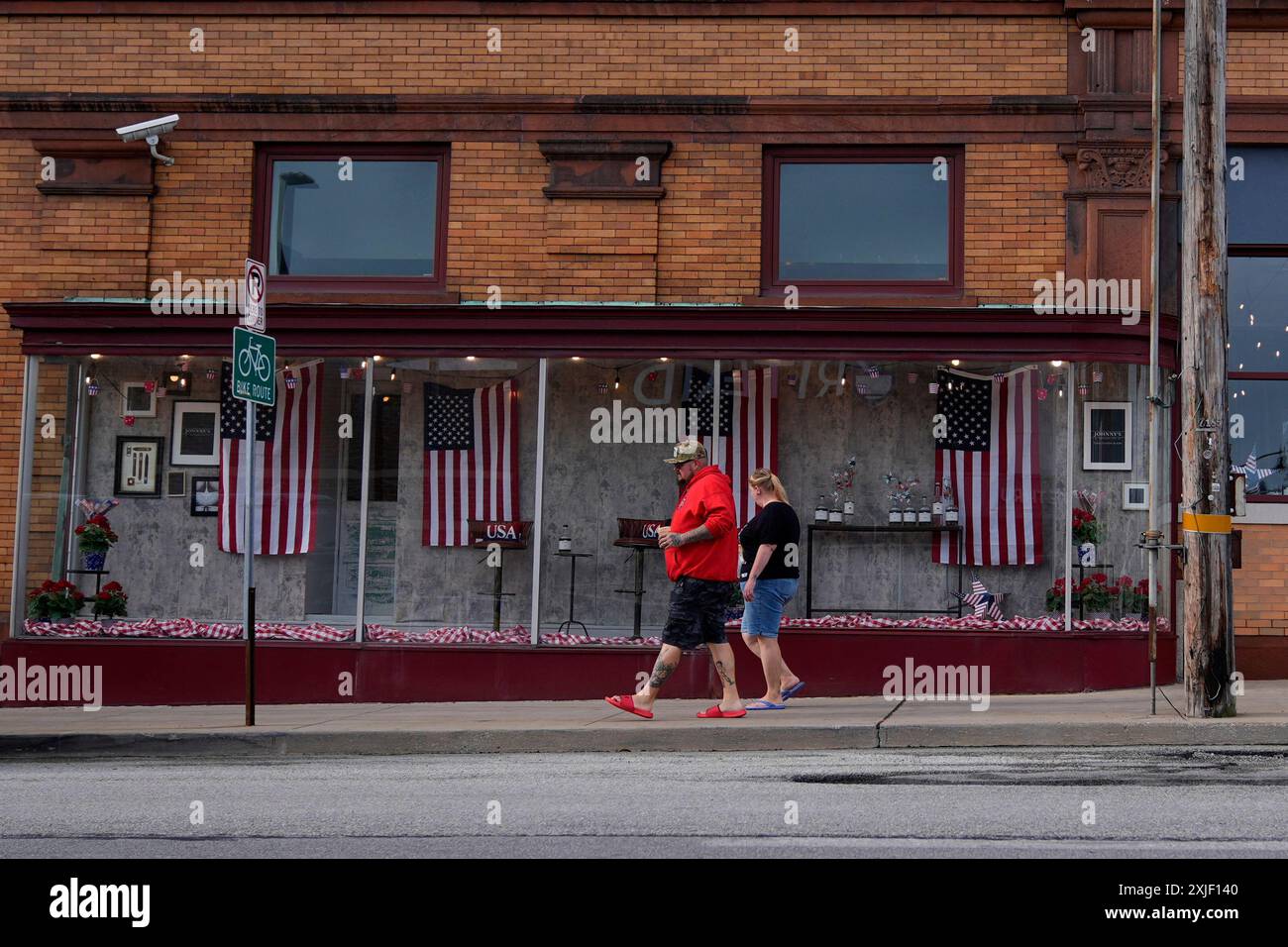 Pedestrians walk along Main Street in Butler, Pa., Thursday, July 18 ...