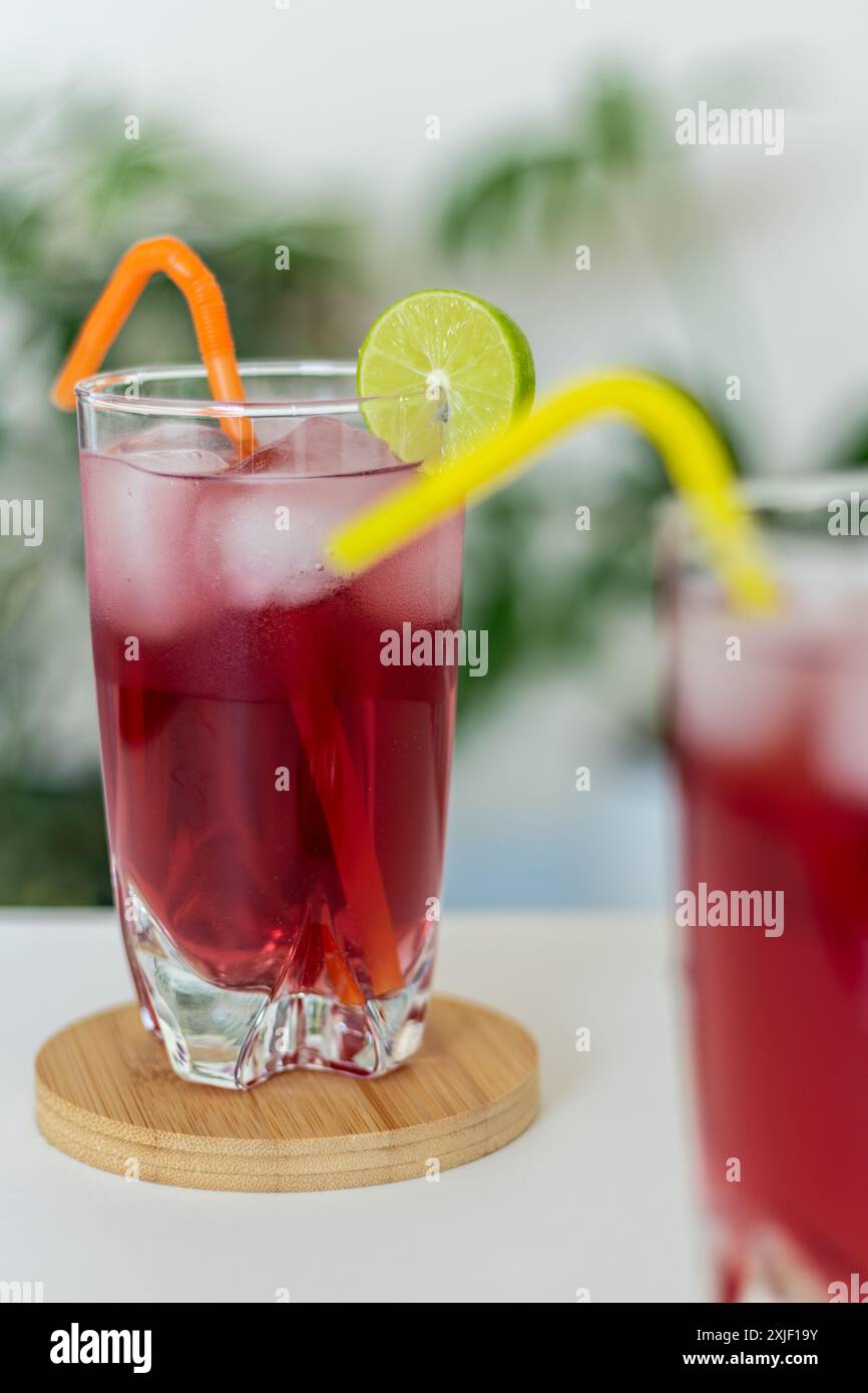Two cherry drinks with straws Stock Photo - Alamy
