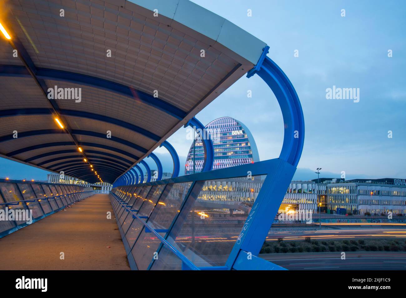 La Vela building from the footbridge over A1 motorway, night view ...