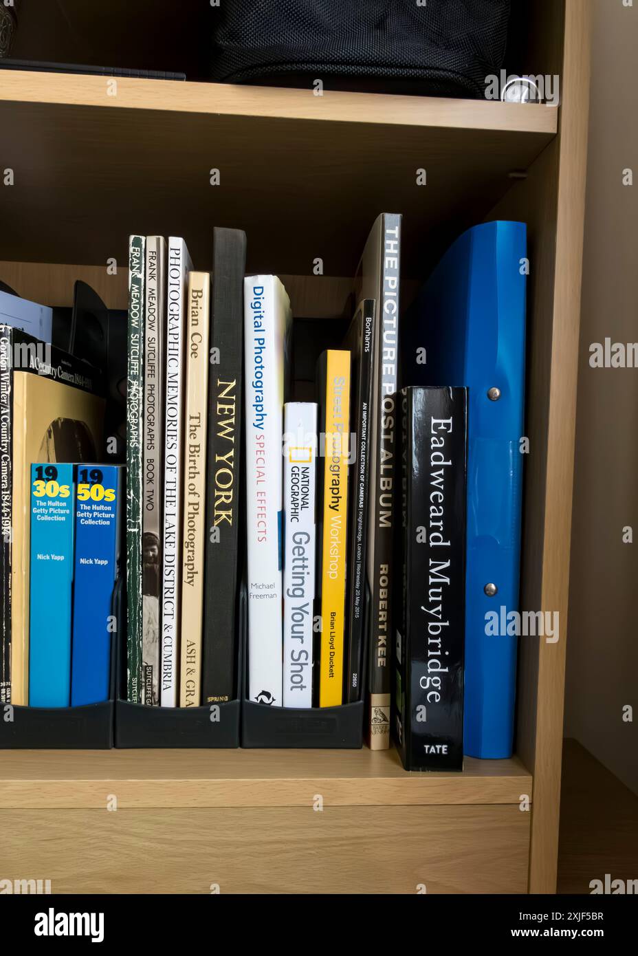 Photography books in bookcase Stock Photo - Alamy