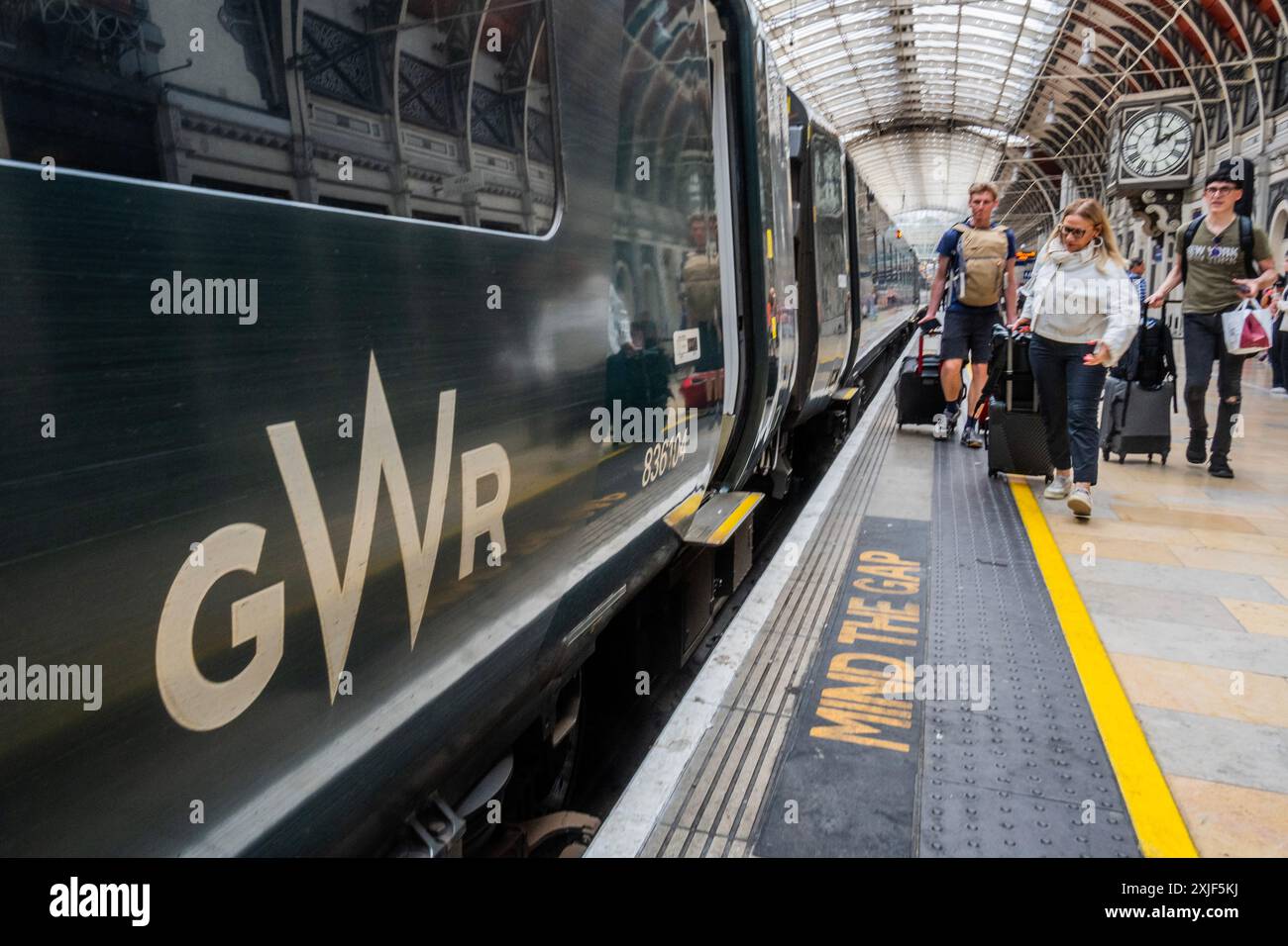 London, UK. 18th July, 2024. Passengers await or board trains at Paddington Station - Railways ...