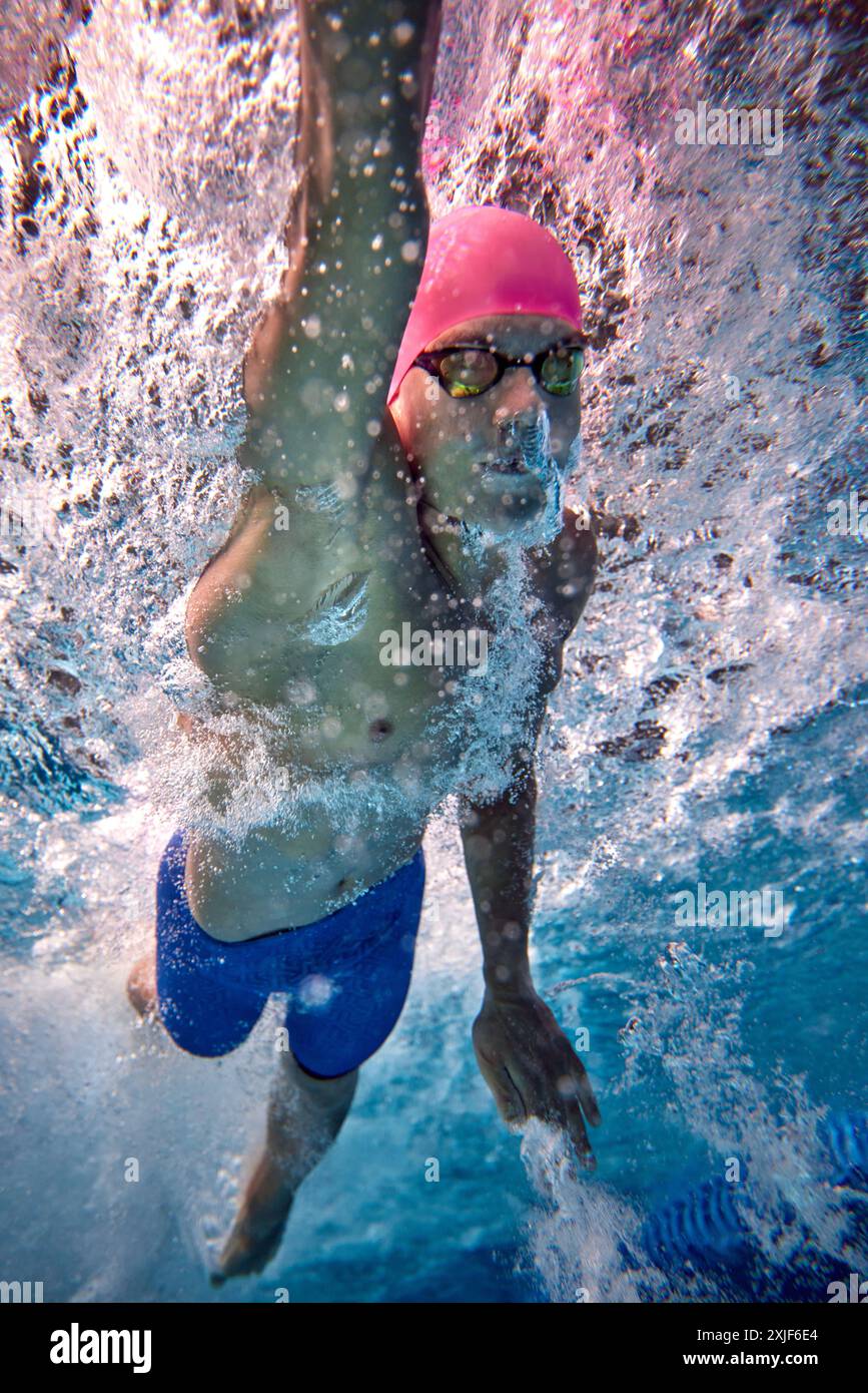 Intensity of swimming. Sportsman swimming freestyle, his body ...