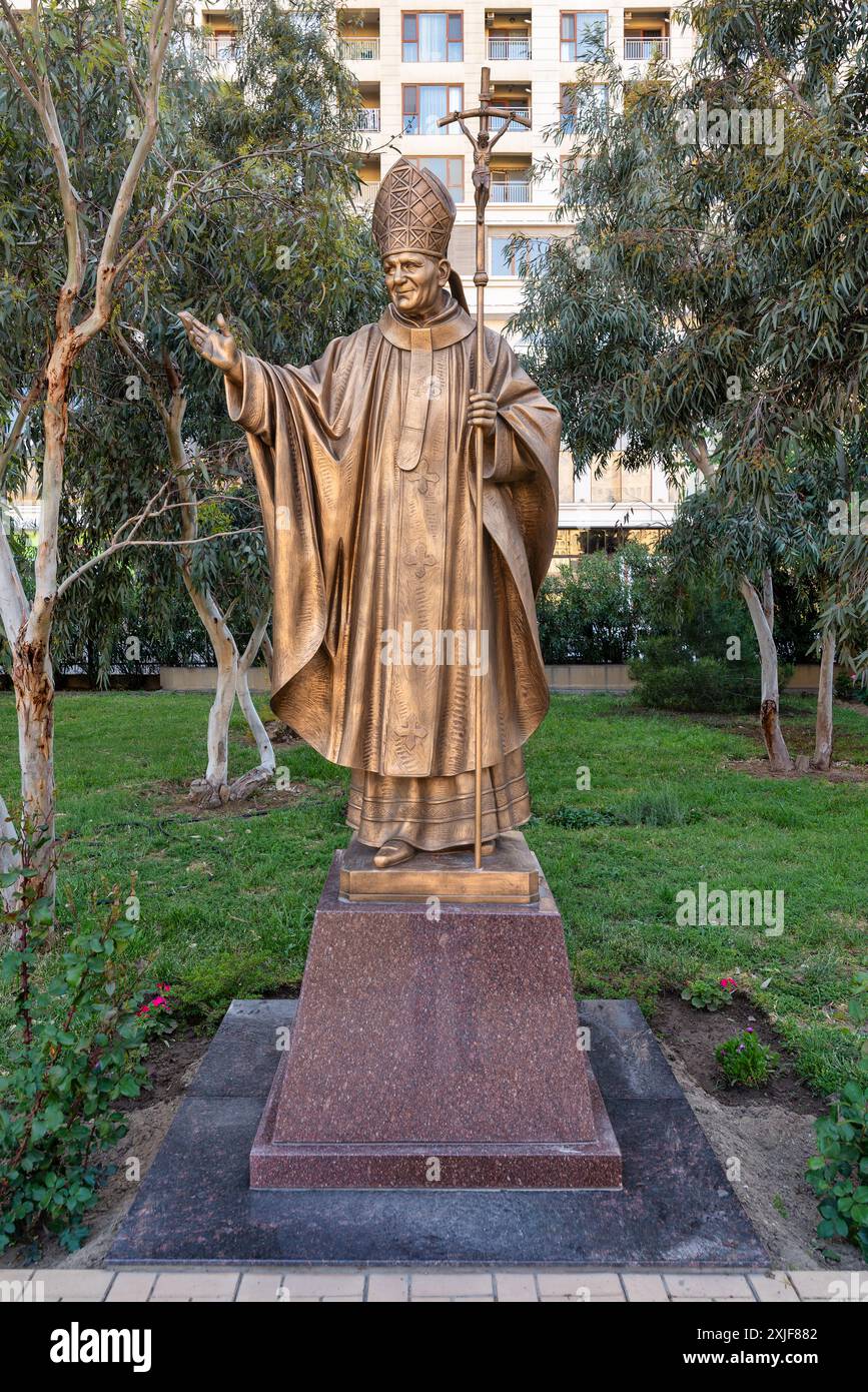 Baku, Azerbaijan - May 10, 2024: A bronze statue of Pope John Paul II ...