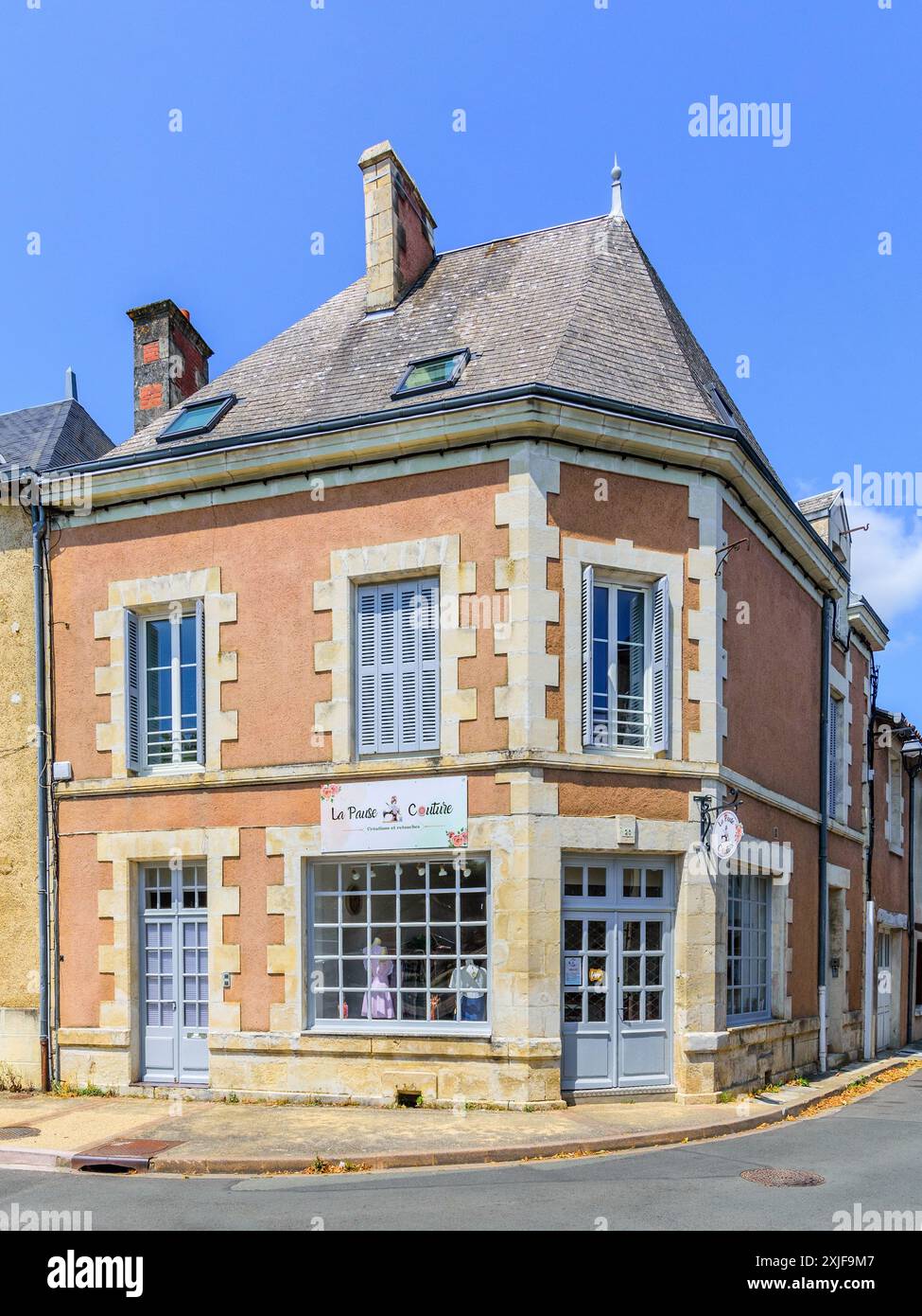 Clothing corner shop in traditional brick and stone building - Bonneuil ...