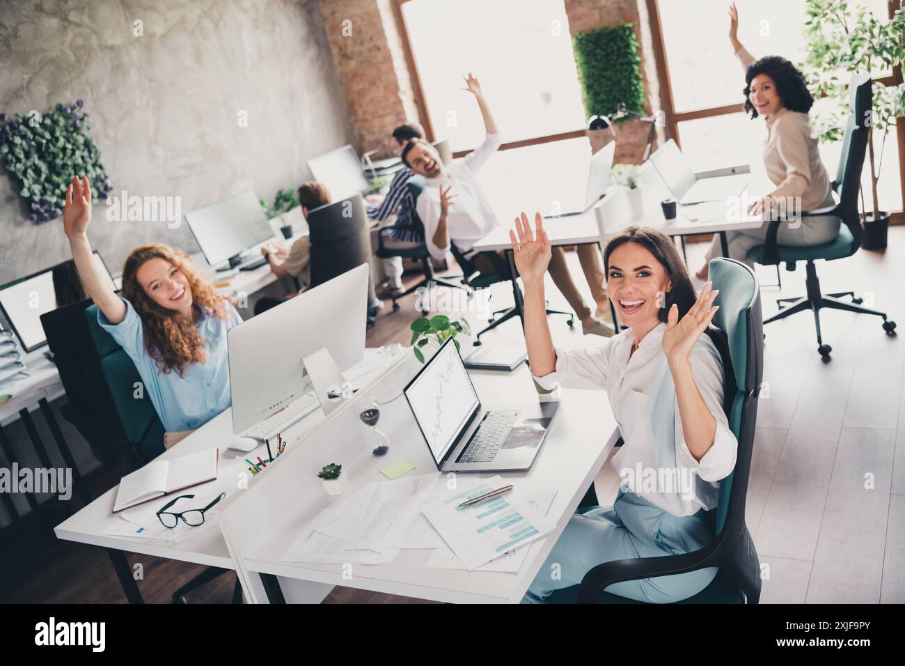 Photo of sit table raise hands excited teamwork young people work ...