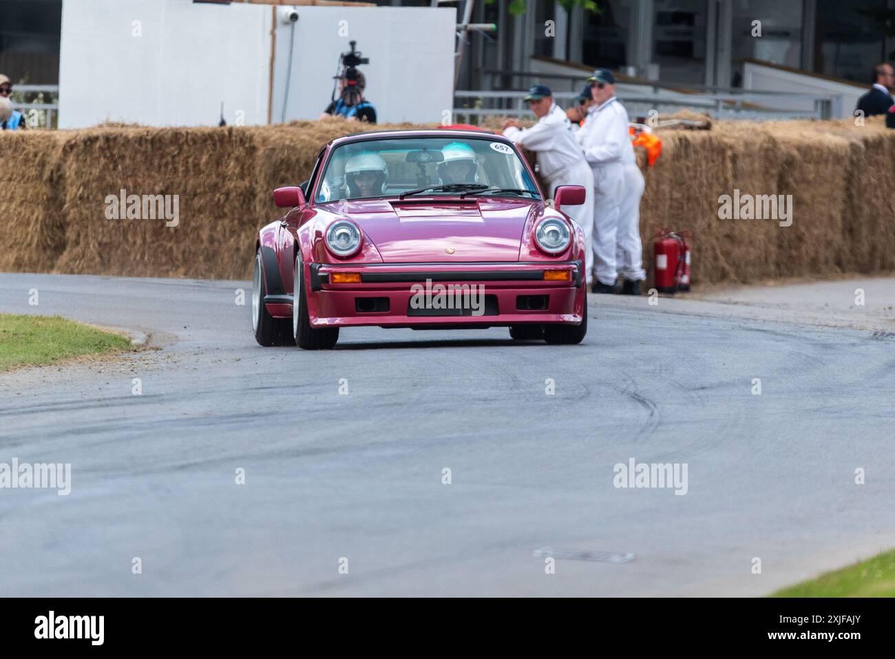 2024 Porsche Lanzante 930 TAG Turbo sports car driving up the hill ...