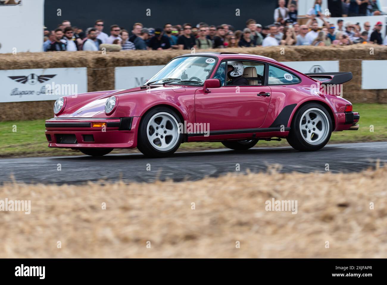 2024 Porsche Lanzante 930 TAG Turbo sports car driving up the hill ...