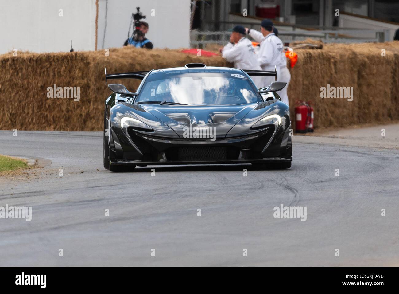 2024 McLaren Lanzante P1 HDK LM25 sports car driving up the hill climb ...