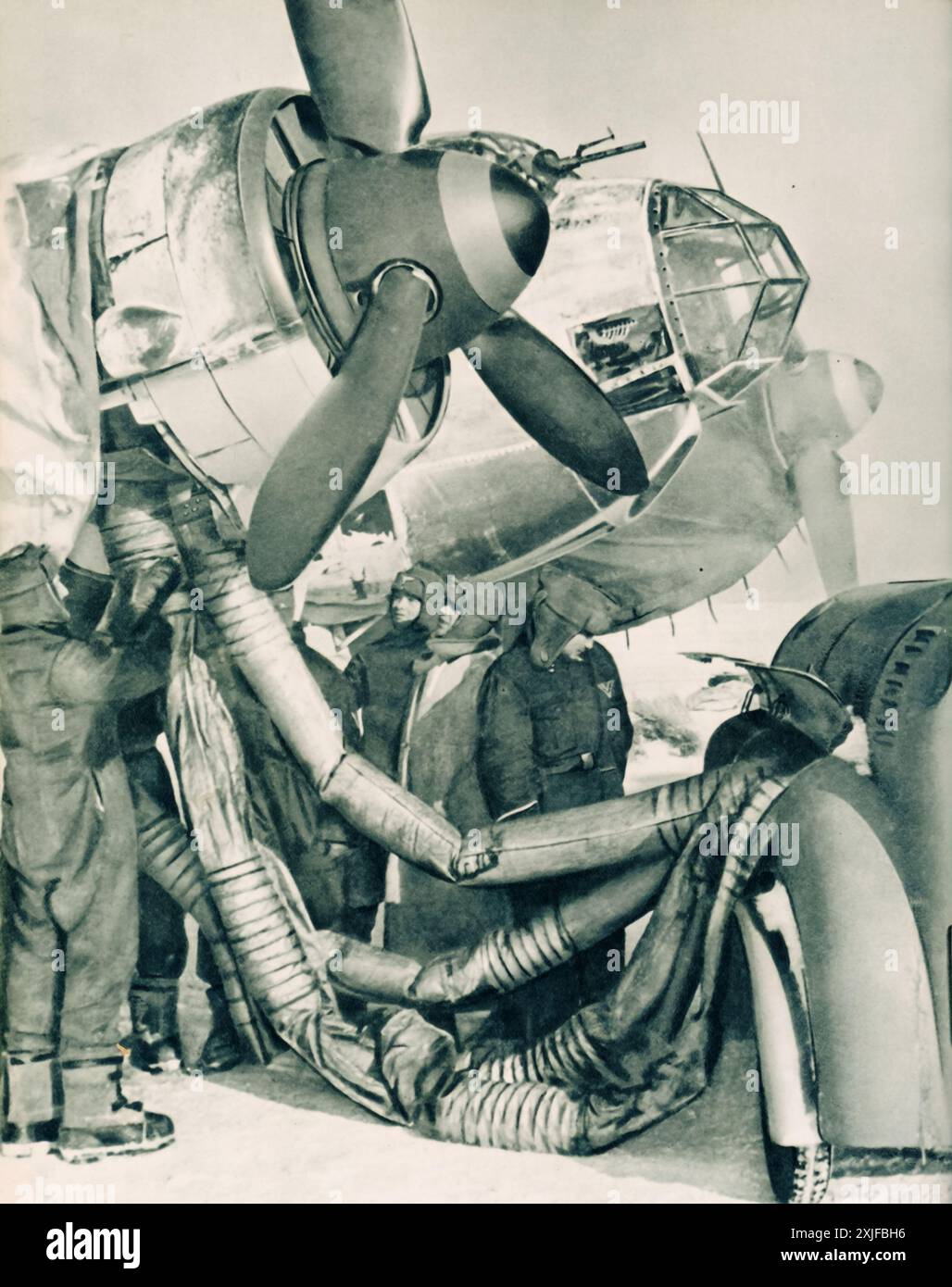 A photograph shows flexible pipes transferring heat from a car to the ...